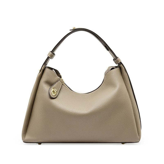 Trapezoid leather crossbody handbag with adjustable strap, featuring ...